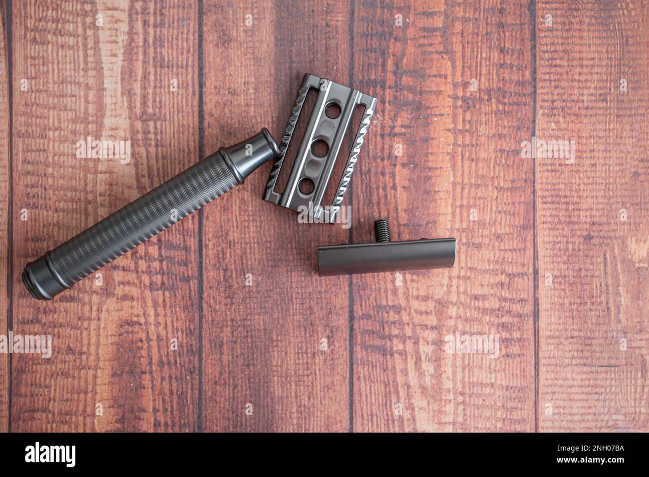 Safety razor on a wood table background Stock Photo - Alamy