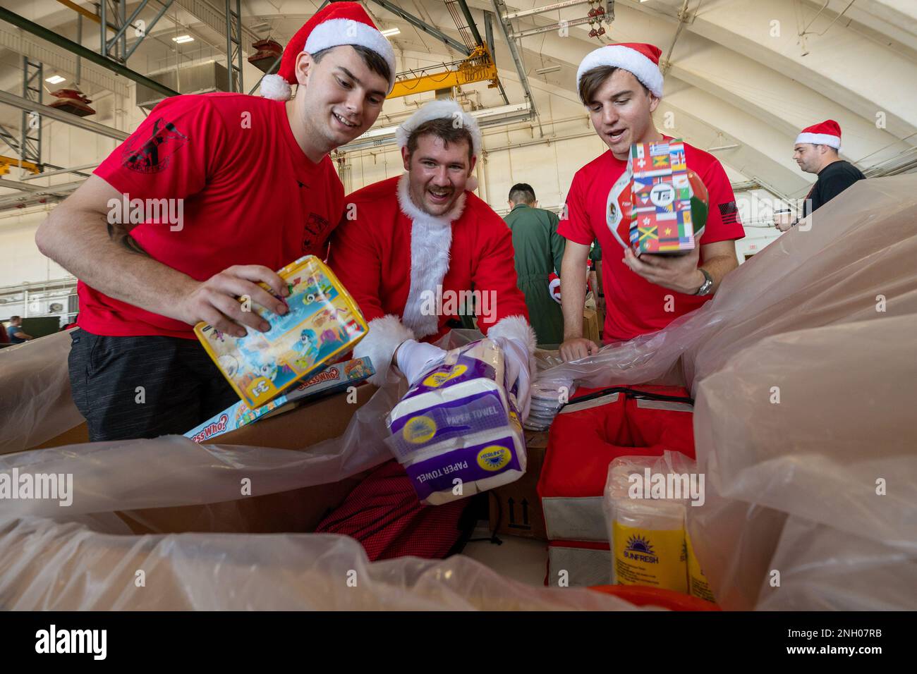 Crewmembers with the 36th Expeditionary Airlift Squadron add items to a ...