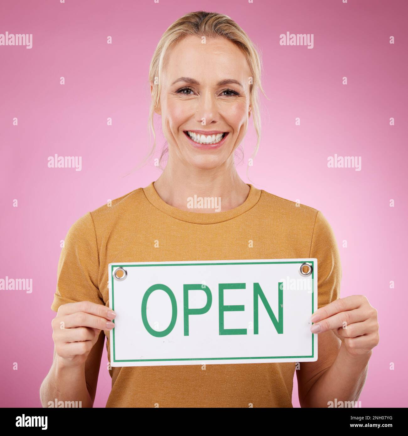Woman, open sign and portrait in studio, announcement or welcome on ...