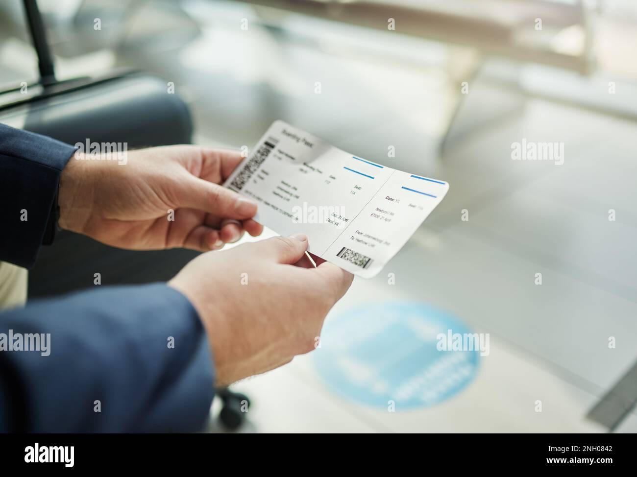 Plane ticket in hands, travel and person at airport, waiting on flight ...