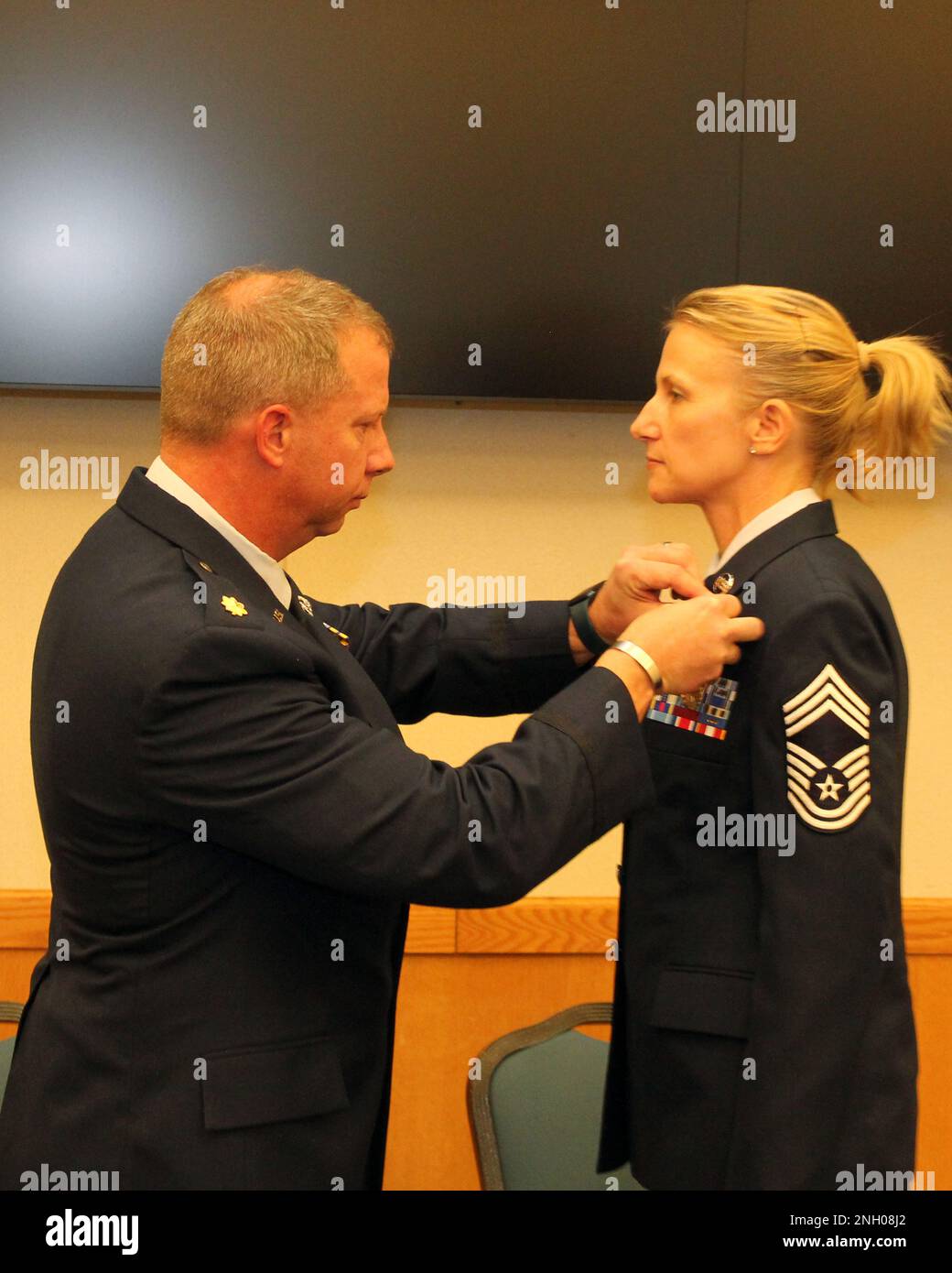 Major Jeremy Bishop, 127th Communications Flight commander, pins the ...