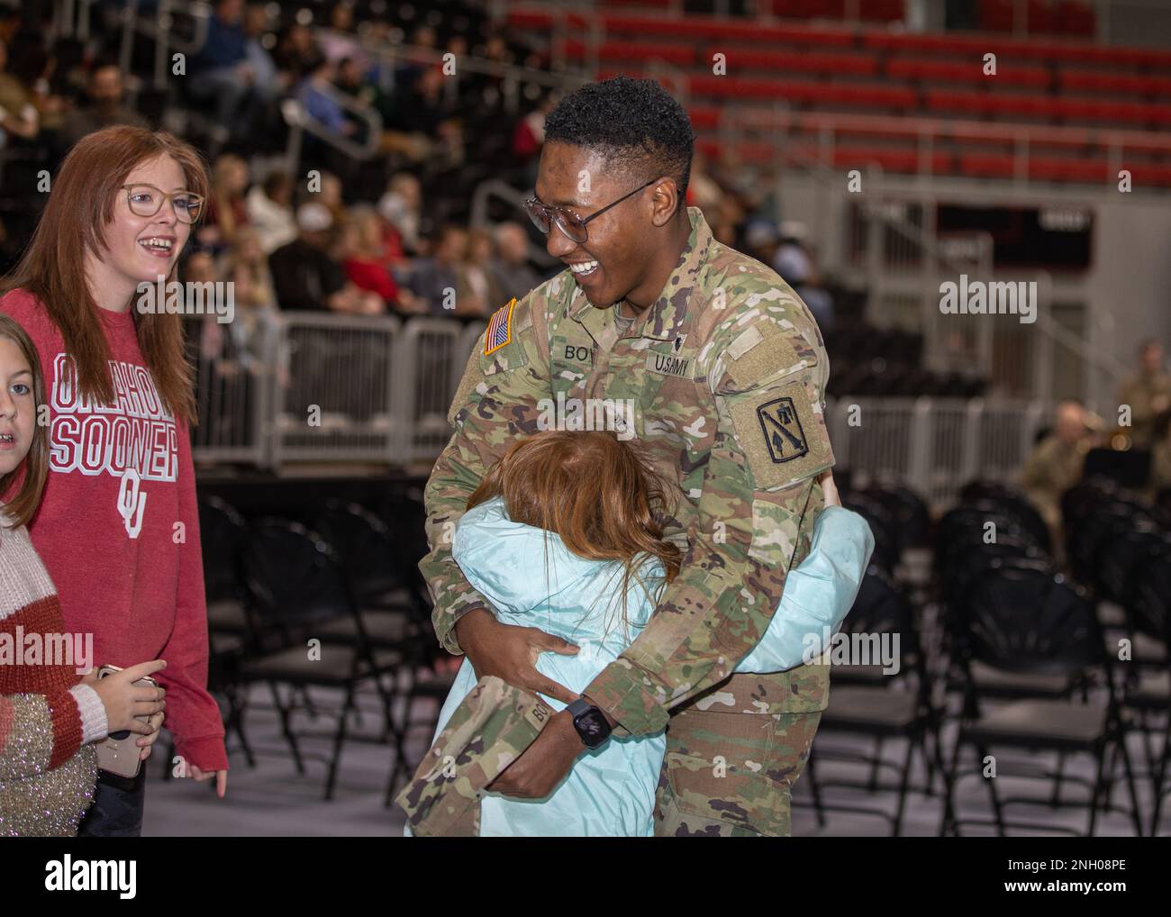 An Oklahoma National Guard Soldier hugs a family member at the deployment ceremony for ...