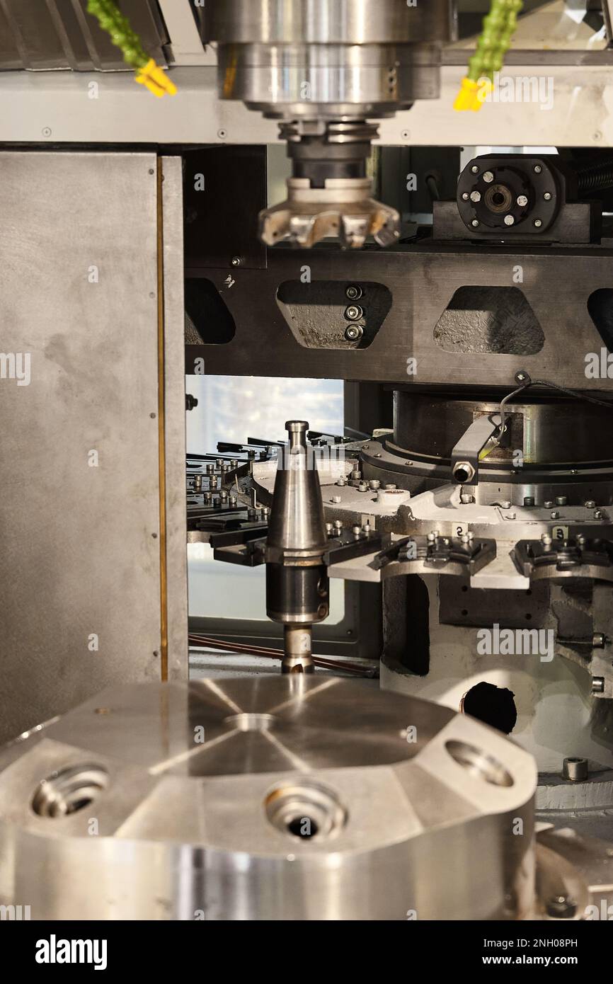 Lathe machine tool with cooling system in metalworking plant Stock ...