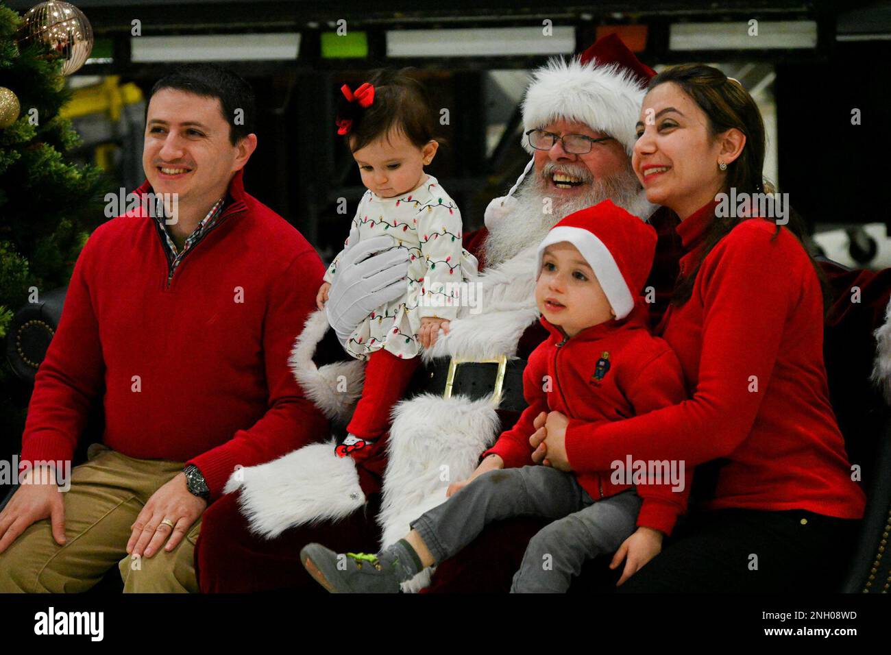 A family of the 126th Air Refueling Wing poses for a photo with Santa ...