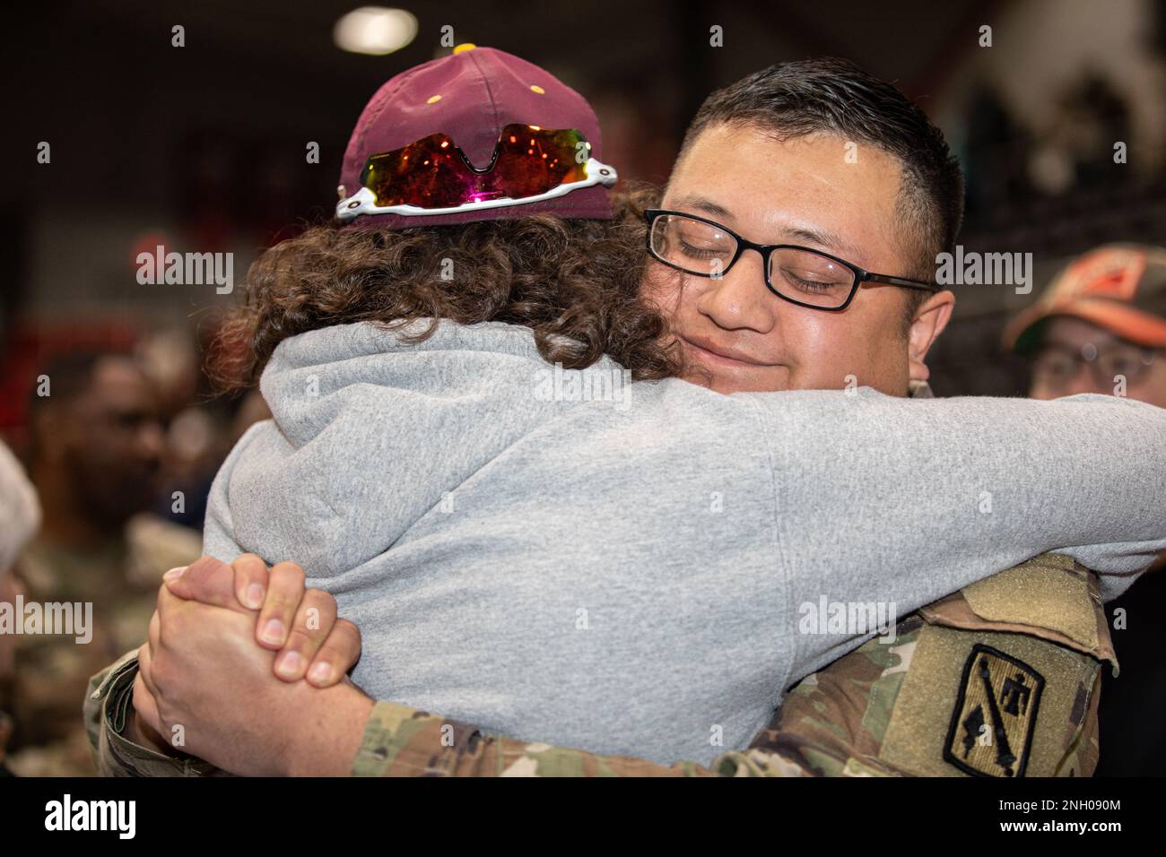 An Oklahoma Army National Guard Soldier hugs a family member at the ...