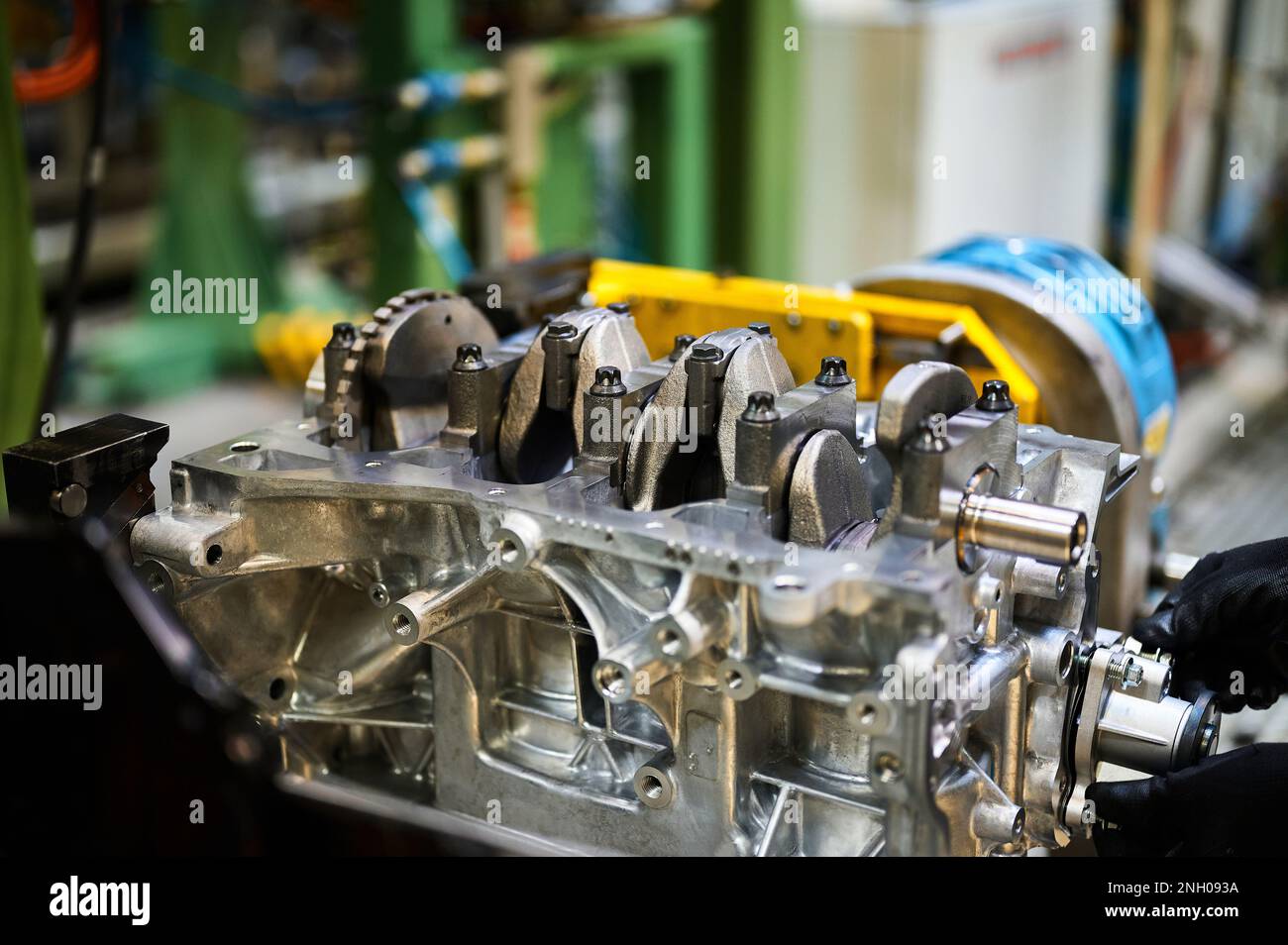 Cylinder block complete with crankshaft. Assembly line of internal ...