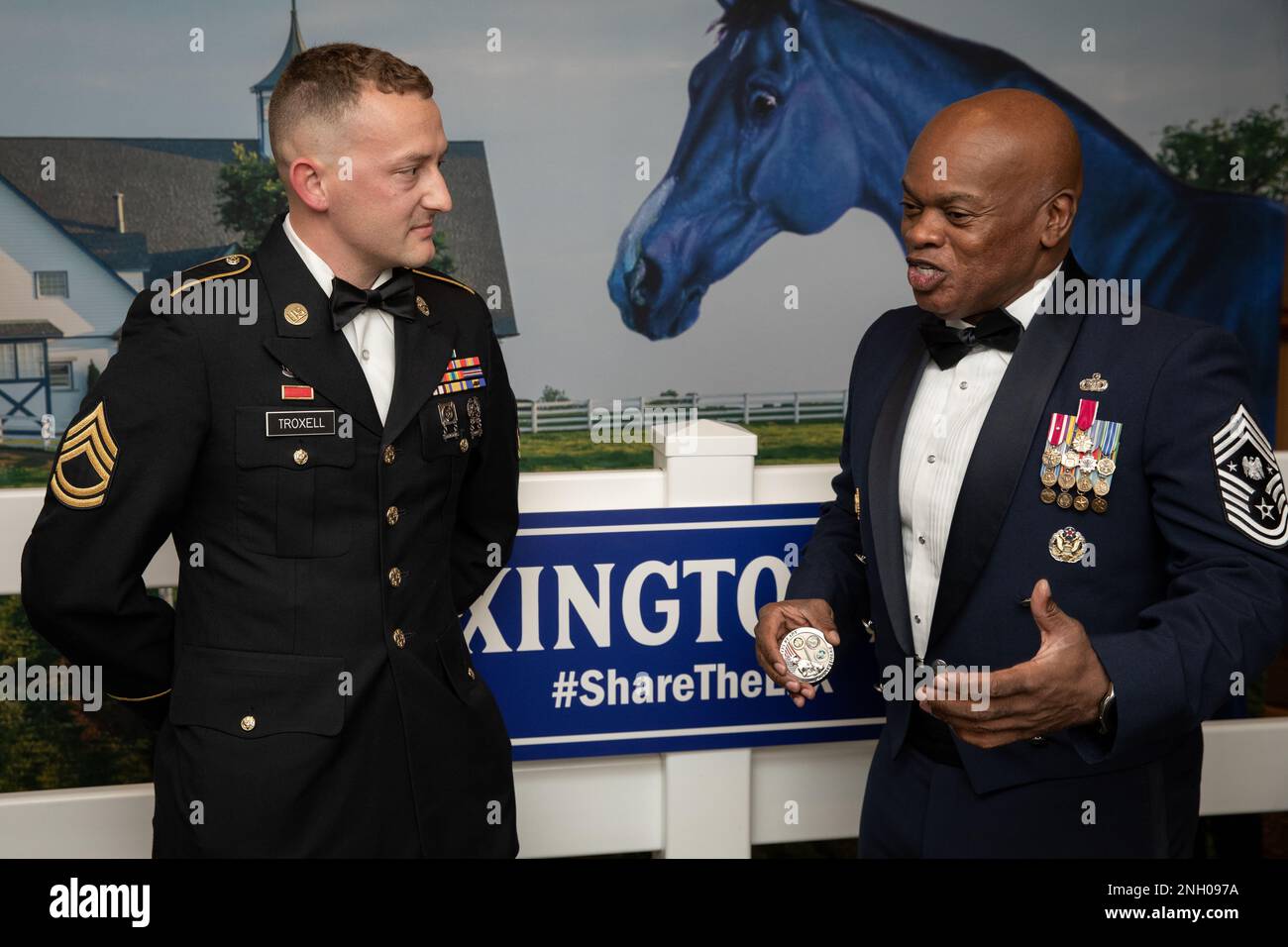 Senior Enlisted Advisor Tony Whitehead (right) presents his coin to ...