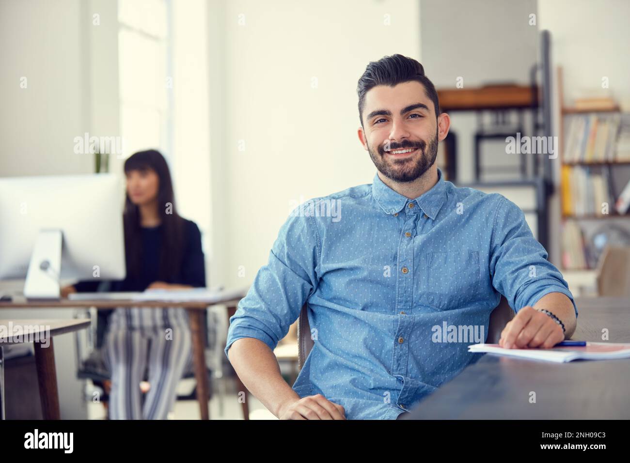 Positive office productive office. Portrait of a young businessman ...