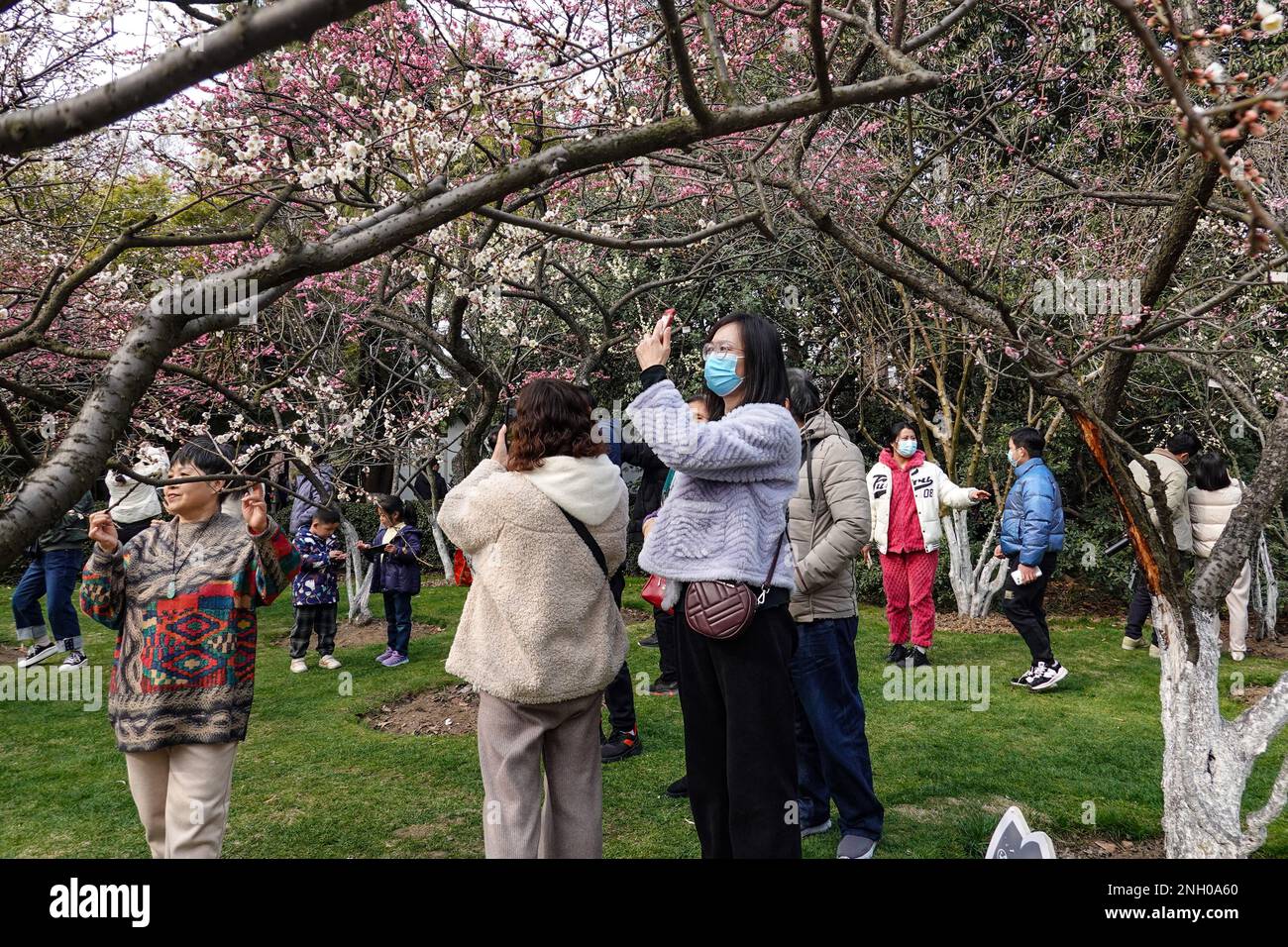People seen watching the Hanfu show at a park. Hanfu is a kind of ...