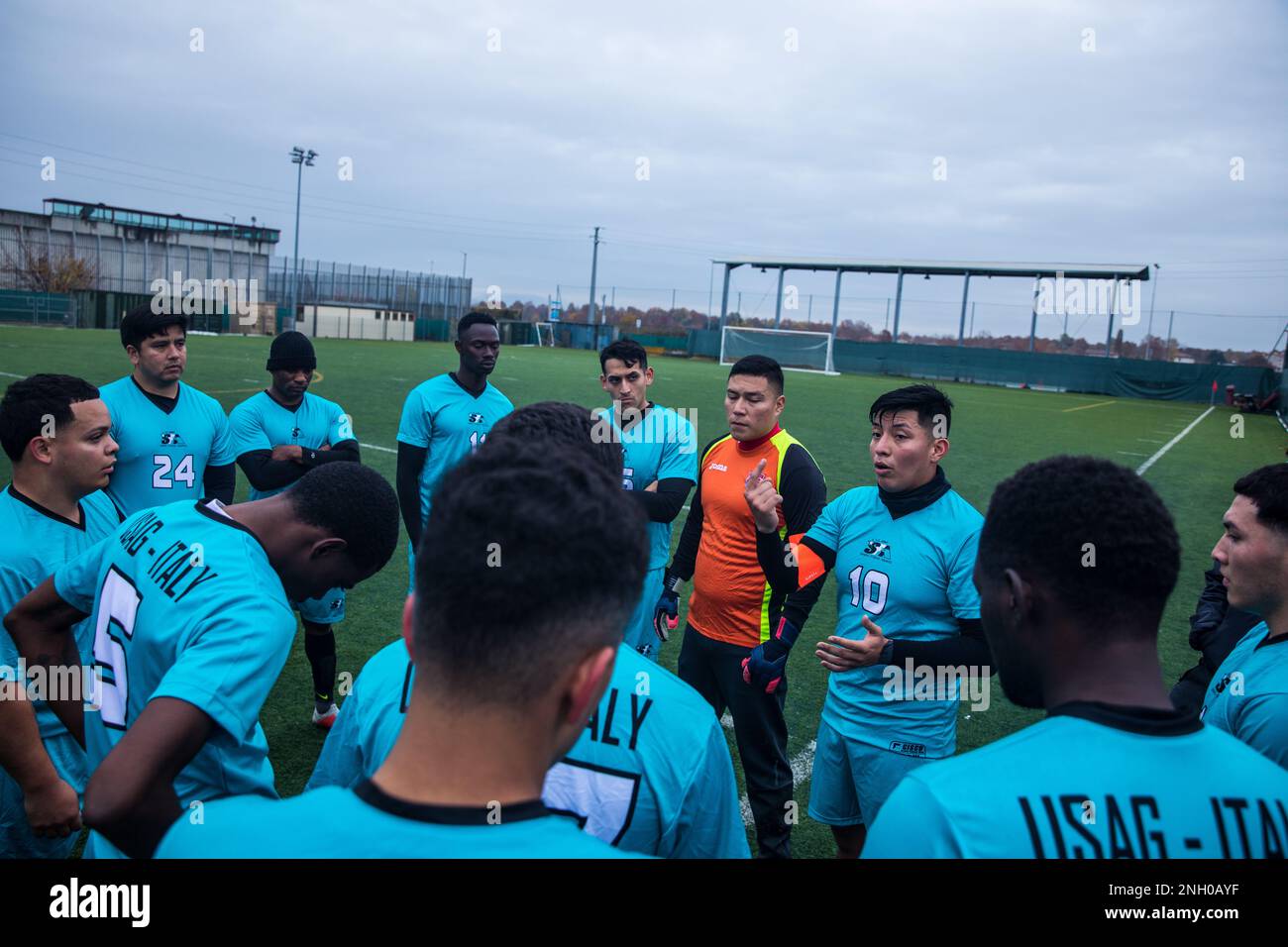 U.S. Army Soldiers conduct a team huddle to discuss the upcoming game ...