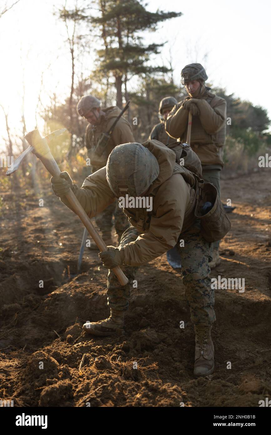 U.S. Marines with 3d Battalion, 12th Marines prepare fighting positions ...