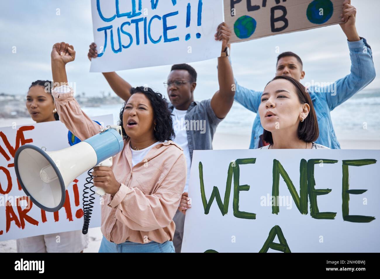 Protest, climate change and megaphone with woman at the beach for ...