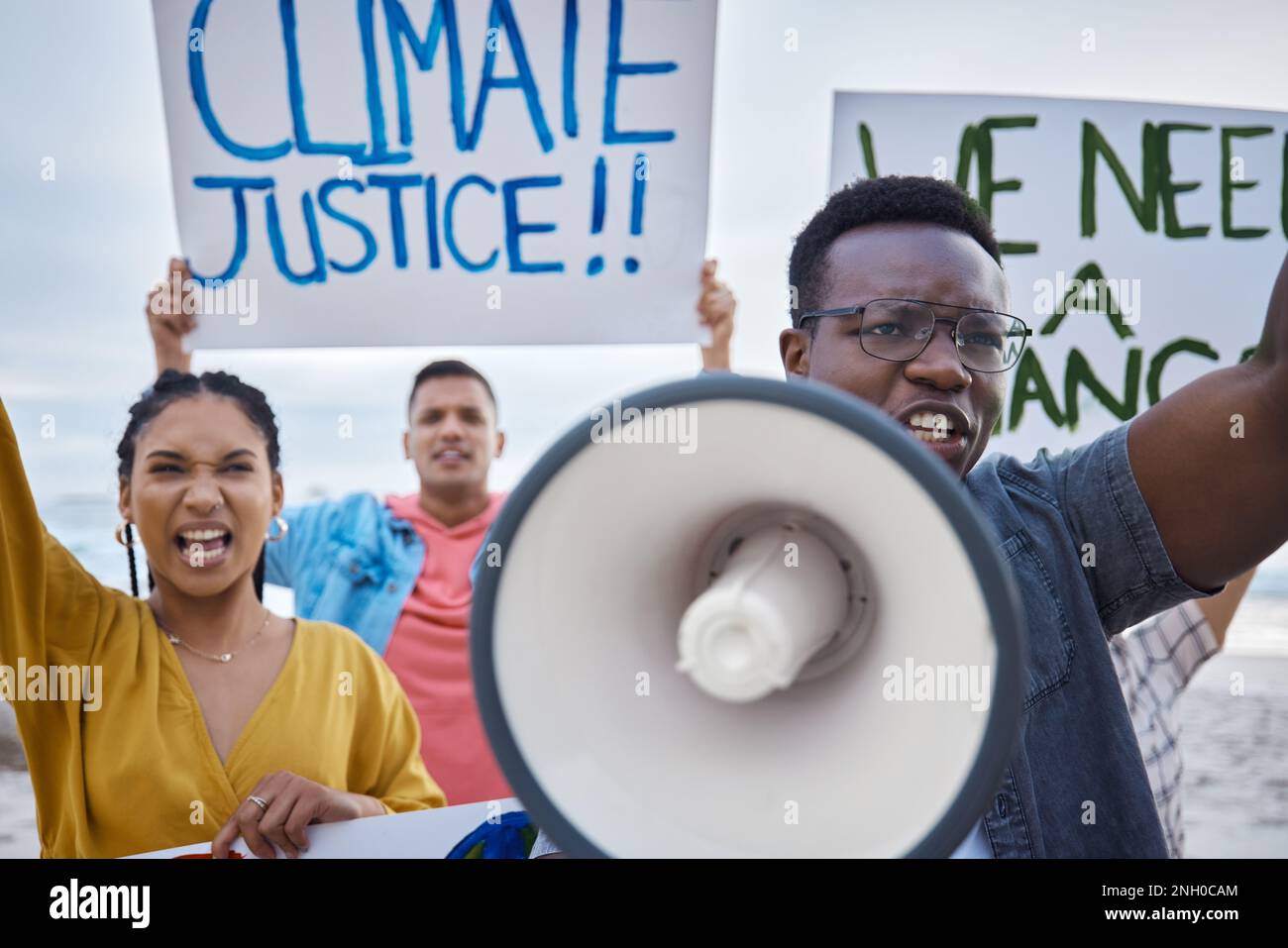 Climate change sign, protest and black man with megaphone for freedom ...