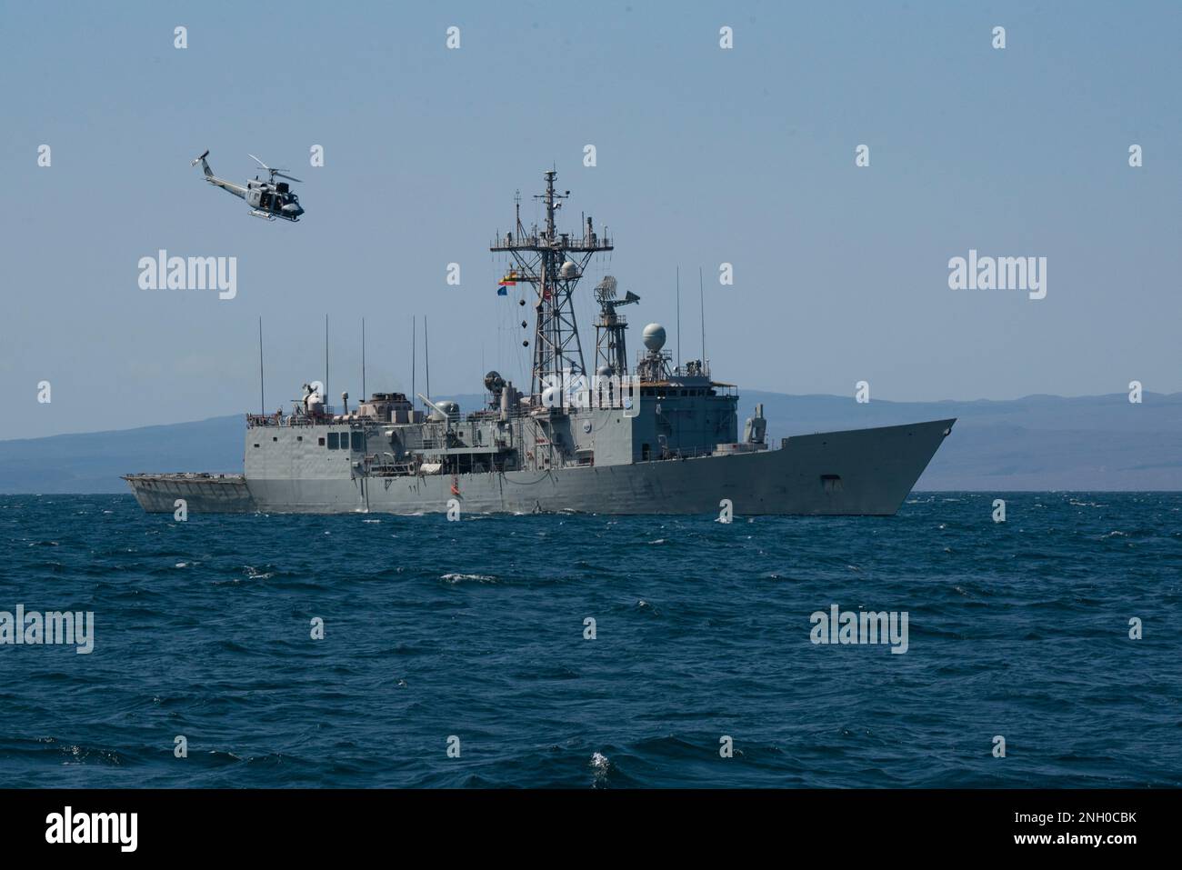 A UH-1N Huey flies above the Spanish frigate Santa Maria during the ...
