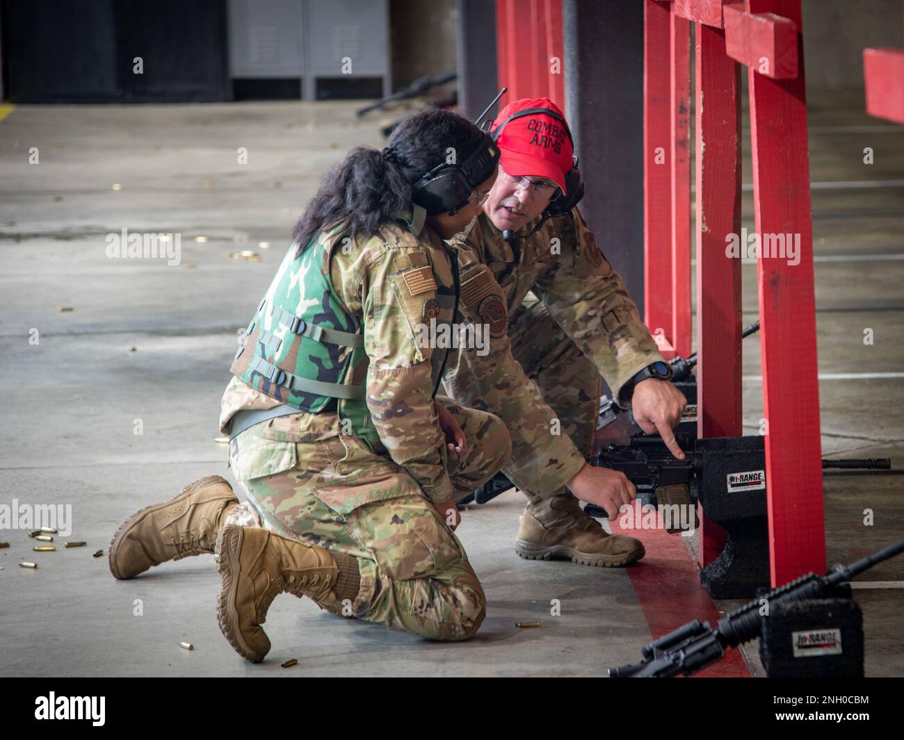 Master Sgt. Christopher Wessel, 512th Security Forces Squadron, assists ...
