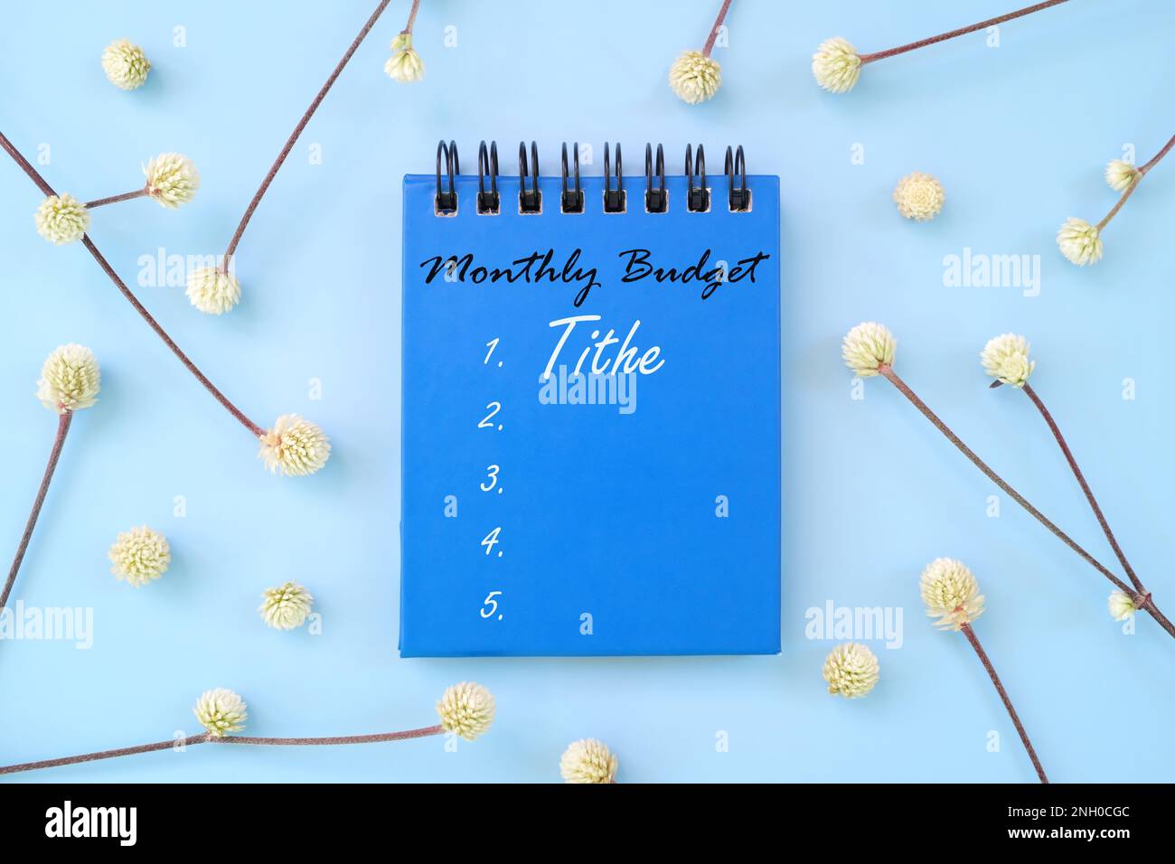 Tithe And Offering As Part Of Budget Priority Concept Notepad With Written Monthly Budget Stock