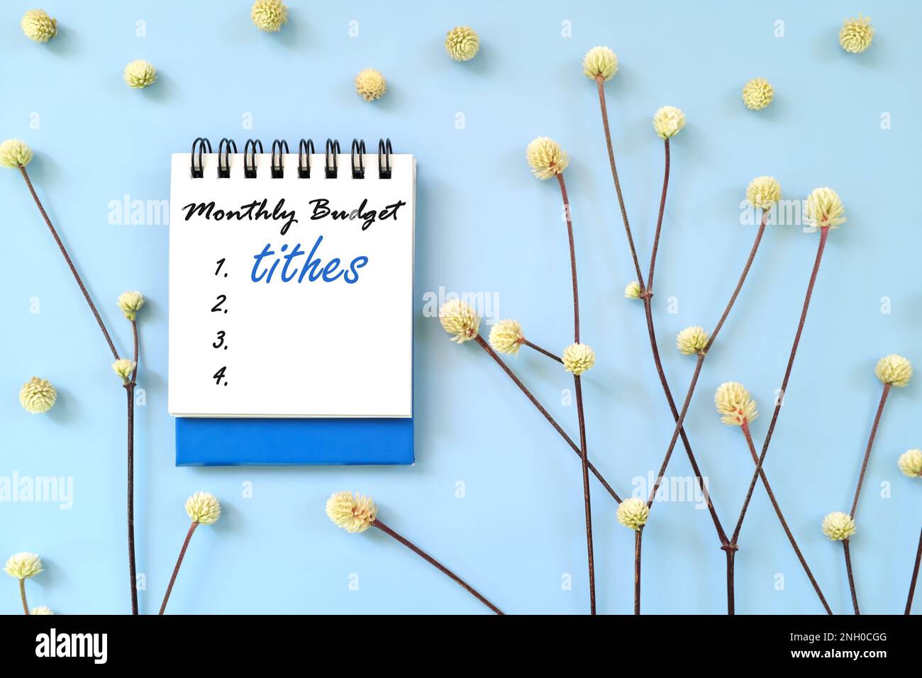 Tithe And Offering As Part Of Budget Priority Concept Notepad With Written Monthly Budget Stock