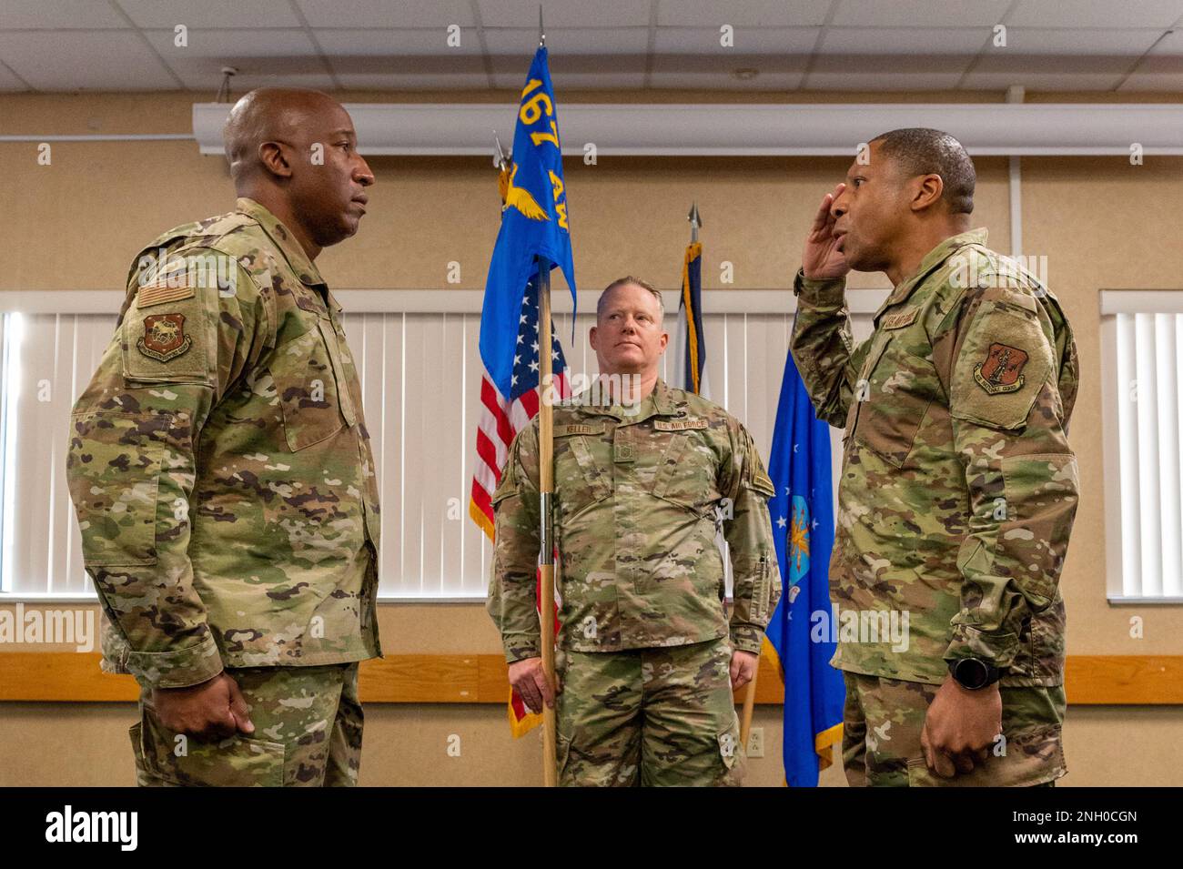 U.S. Air Force Maj. Wayne Harrison salutes Lt. Col. Corey Gause, 167th ...