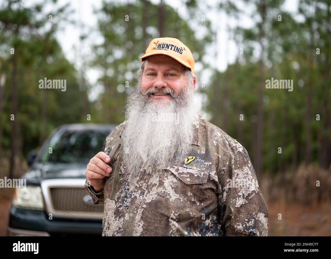 Christopher Tate, a volunteer huntmaster, poses for a portrait during a ...