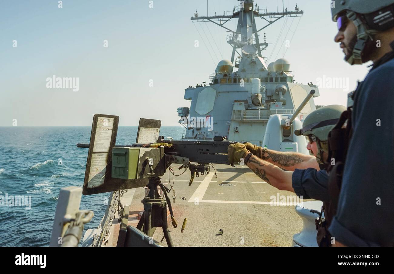 221203-N-EB711-1001 ARABIAN GULF (Dec. 3, 2022) Sailors shoot an M240B ...