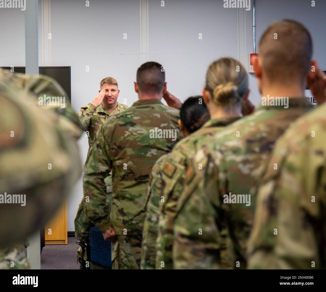 Reserve Citizen Airmen with the 446th Security Forces Squadron salute to their new commander ...