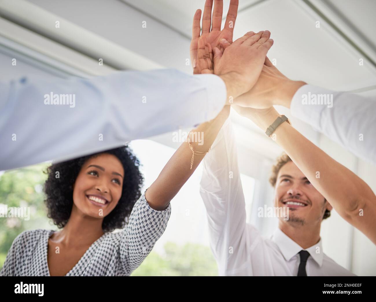 The inspired team is a winning team. a group of businesspeople joining ...
