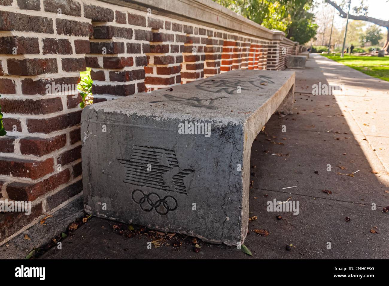 The Olympic rings on a park bench in Los Angeles, commemorating the ...