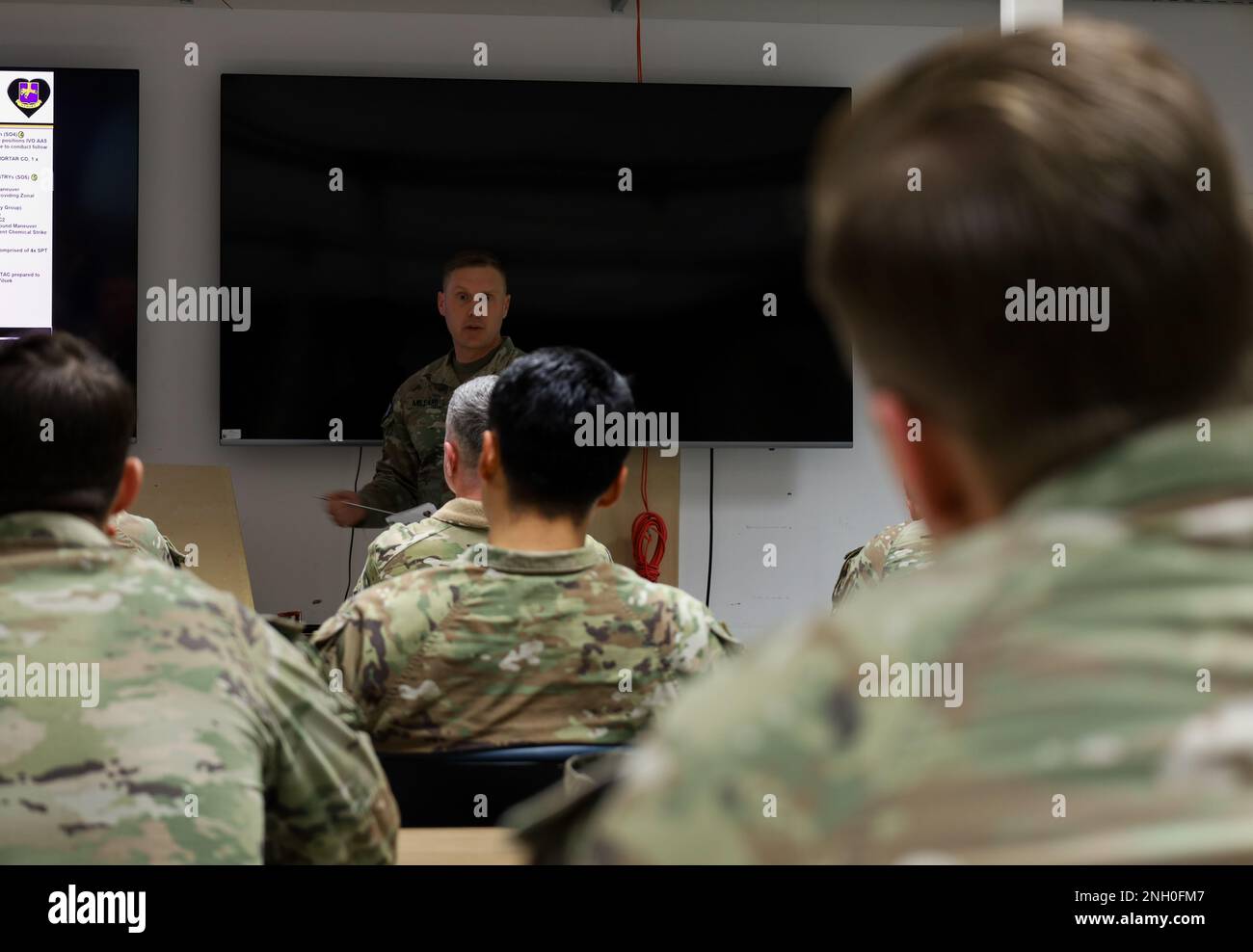 MAJ Kyle Millard, 2nd Brigade Combat Team S2, briefs the tactical order ...