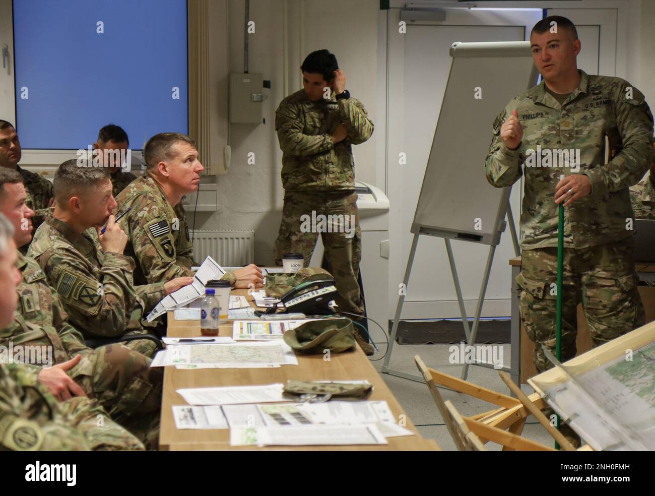 Maj. Michael Phillips, 2nd Brigade Combat Team S6, briefs the tactical ...