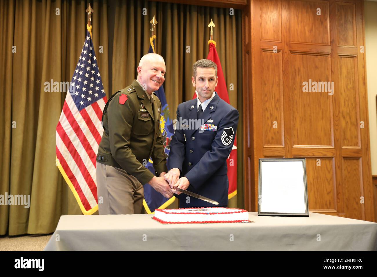 U.S. Army Maj. Gen. Mark Schindler, left, the Adjutant General of ...