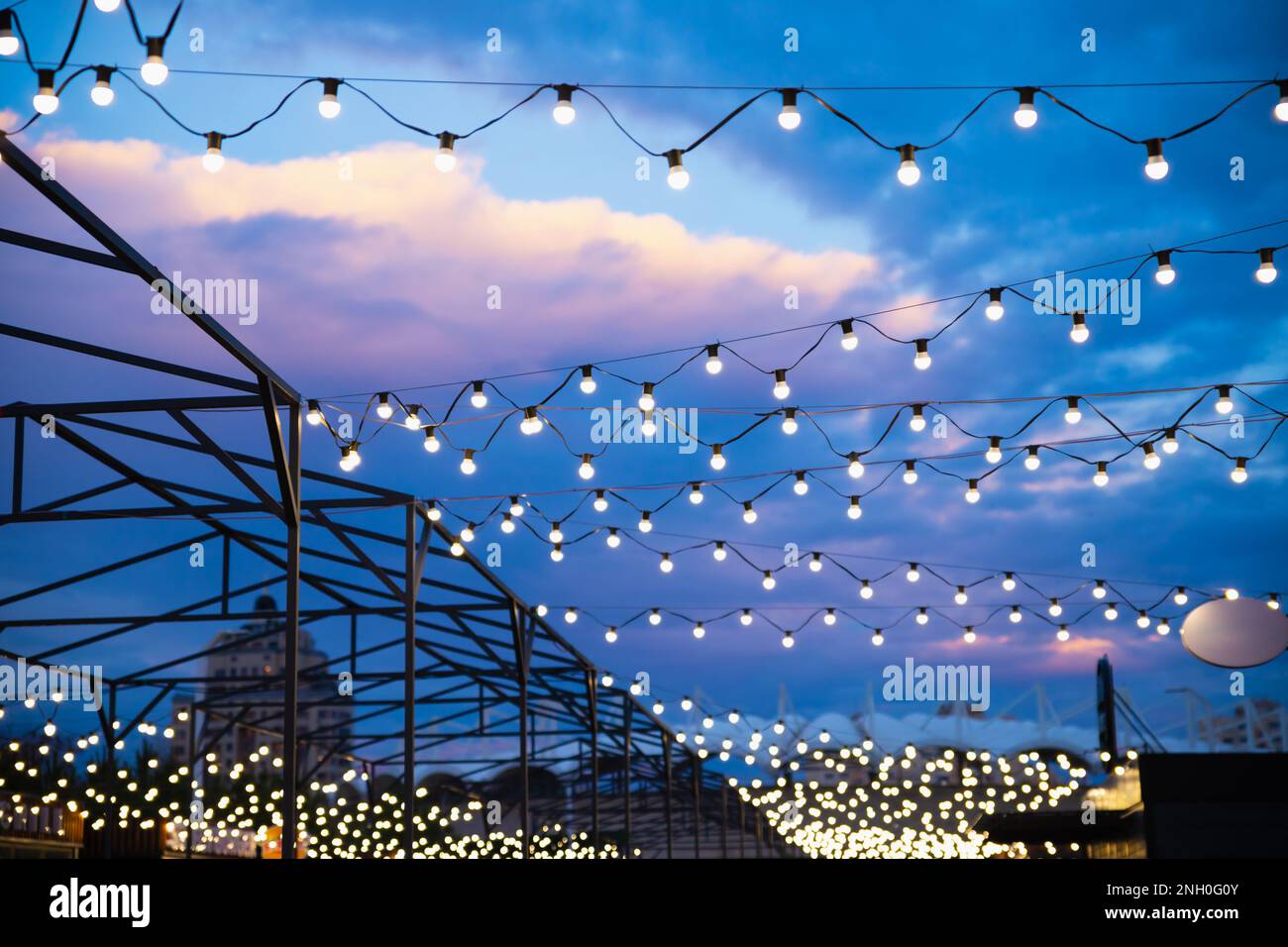 String of light bulb decorations and awning structures for outdoor ...