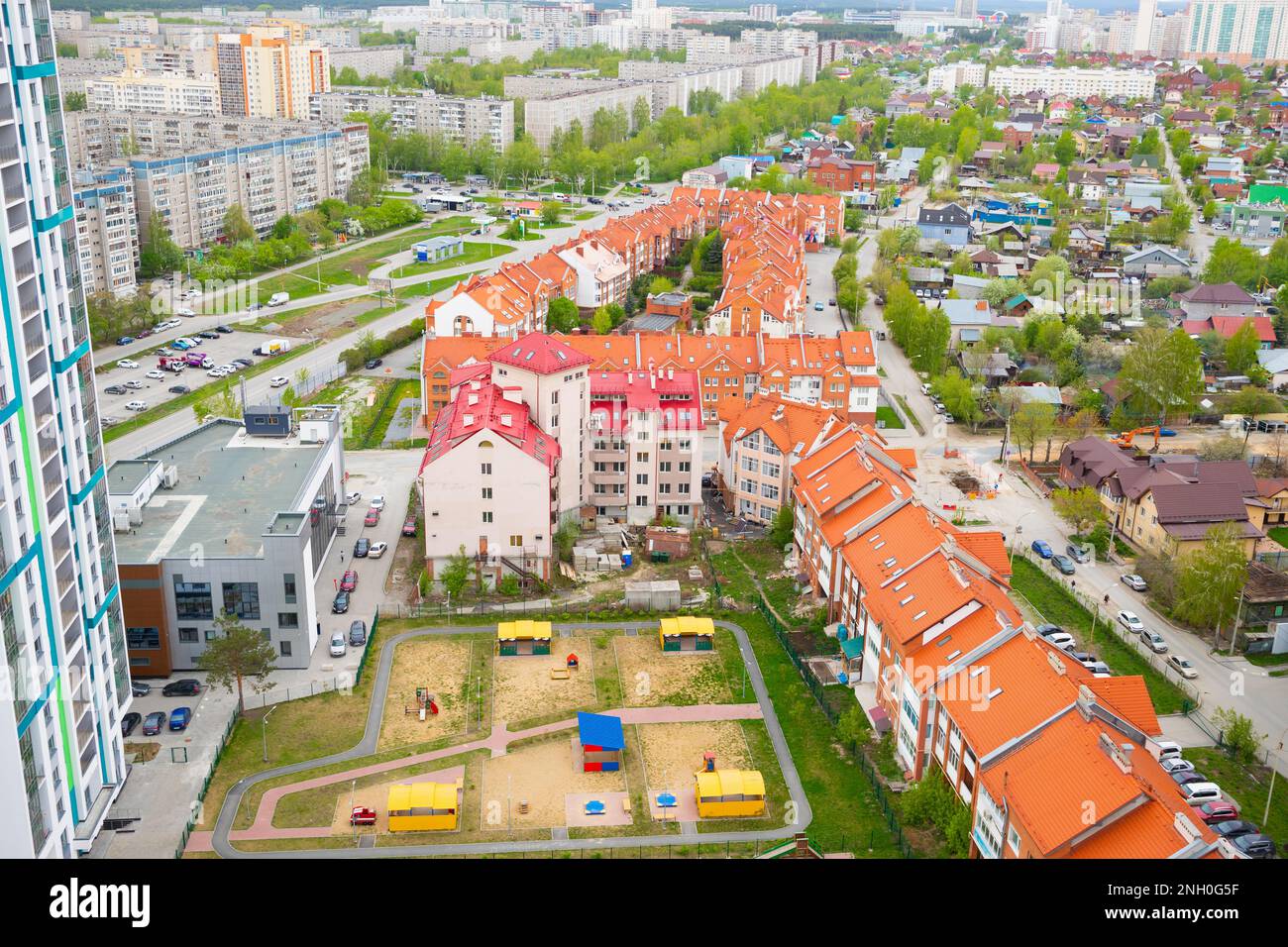 Townhouses, courtyard, playground for children, residential buildings ...