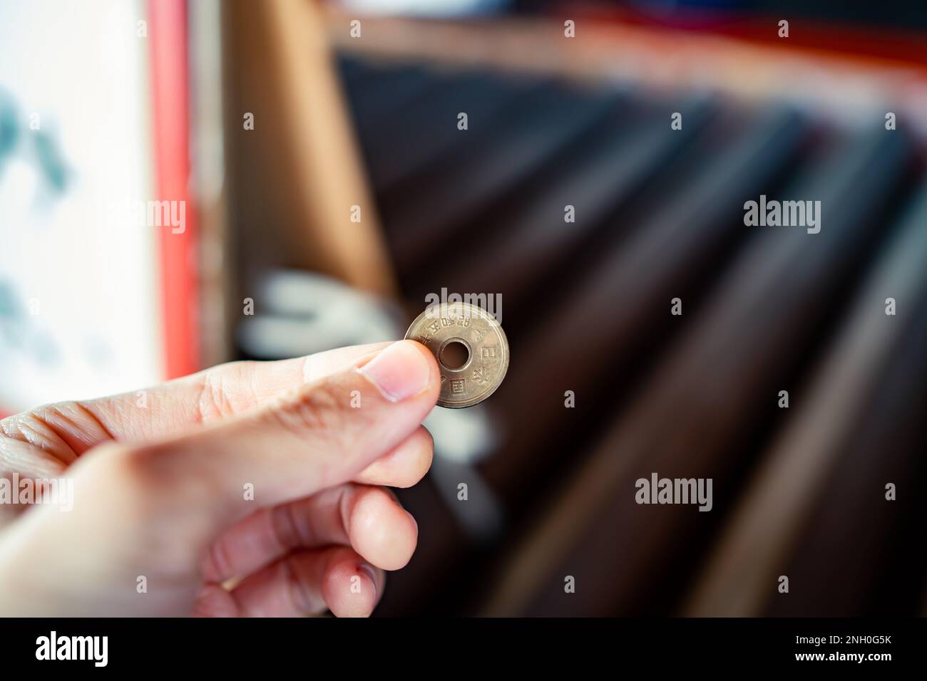 5 yen coin was used for toss into an offering box in Japanese temple ...