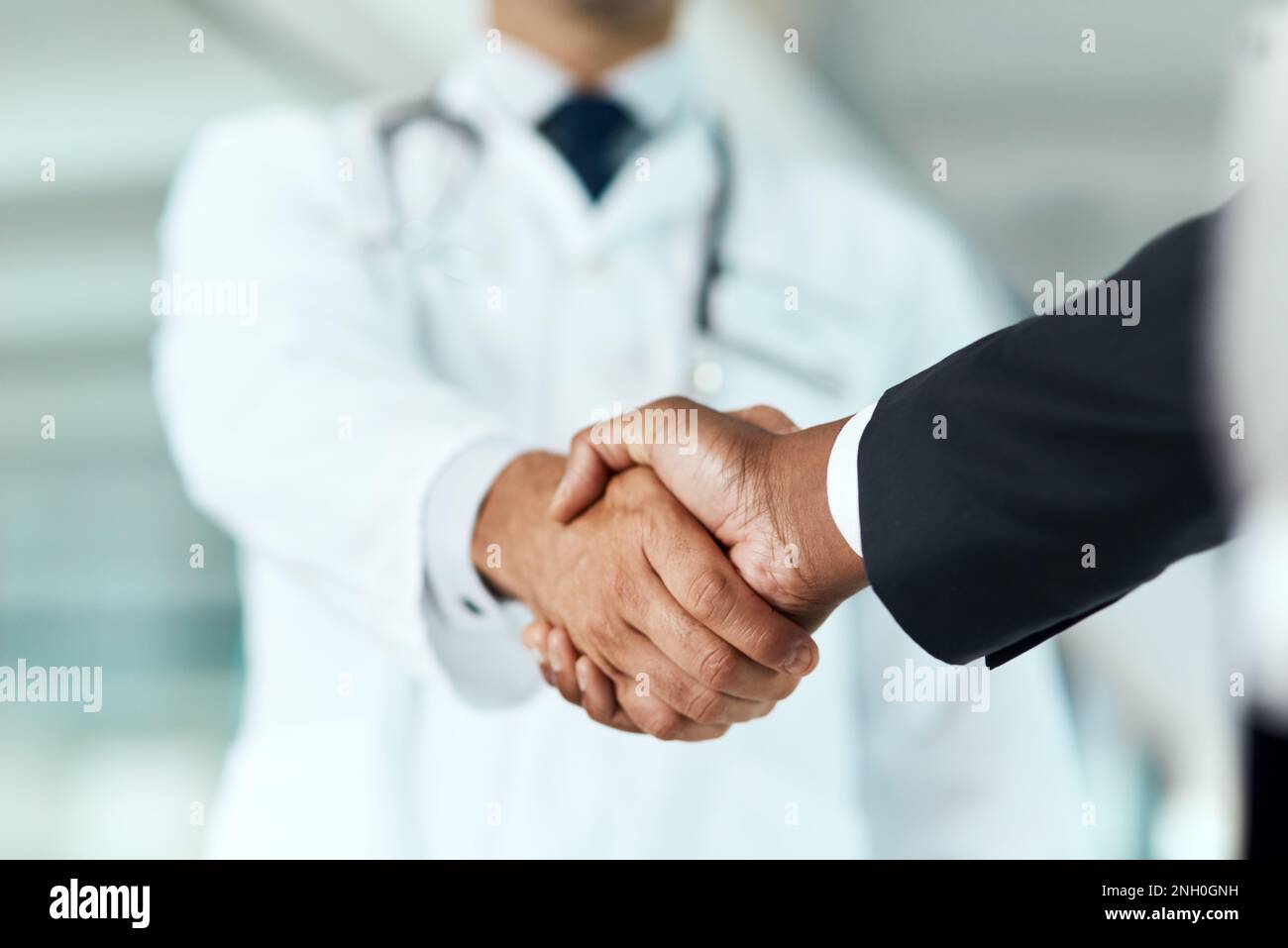Doctor businessman shaking hands hi-res stock photography and images ...