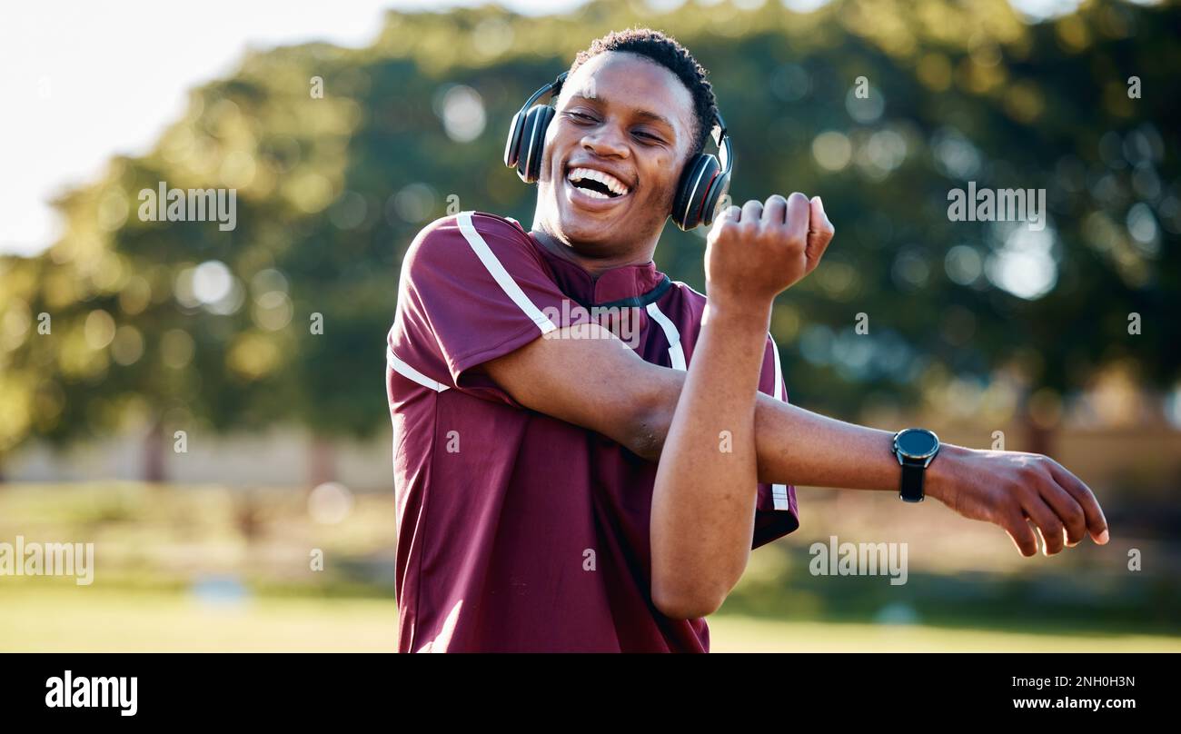 Fitness, headphones and black man stretching for sport and happiness on ...