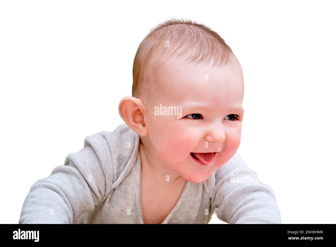 Happy infant baby is playing lying on a mat, isolated on a white ...