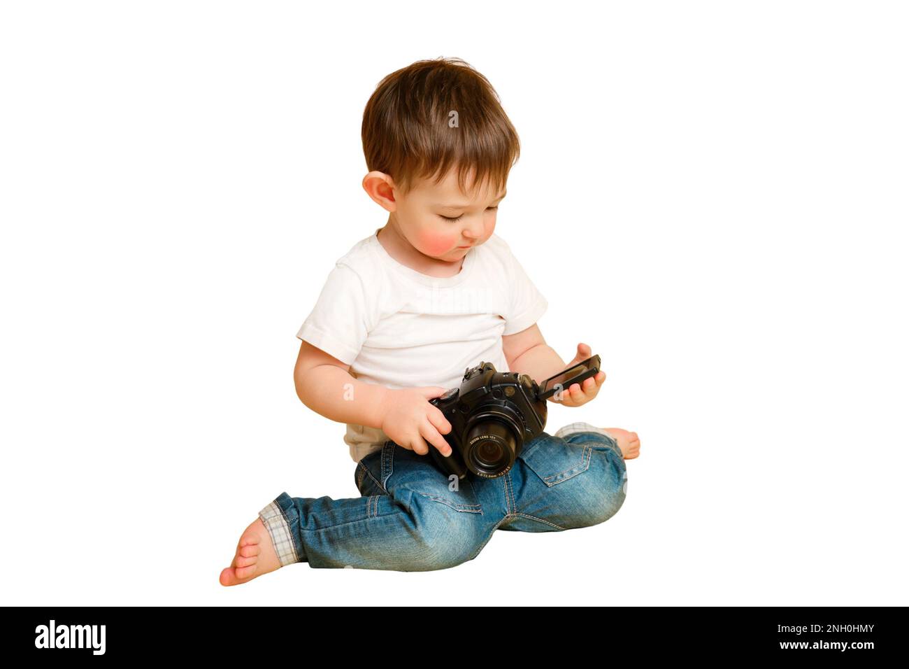 Toddler baby photographer with a camera on a studio isolated on a white ...