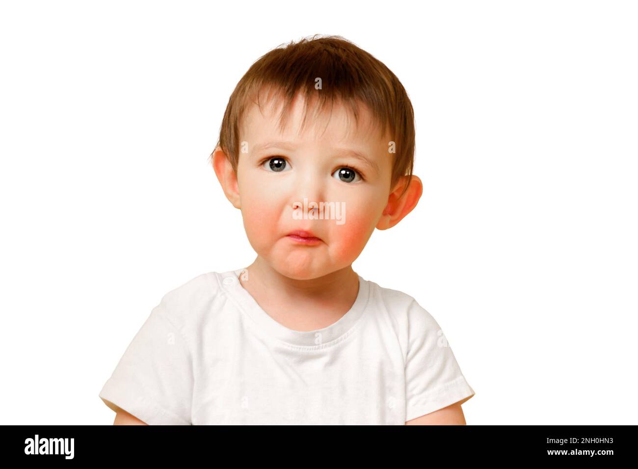 Portrait of an upset toddler baby with a surprised sad face on a studio ...
