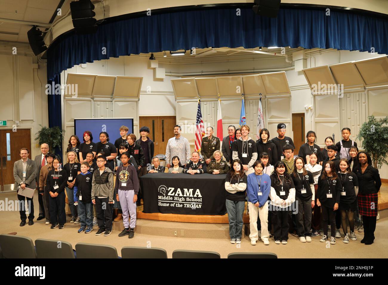 Students from Zama Middle High School and Kanagawa Sogo High pose for a ...