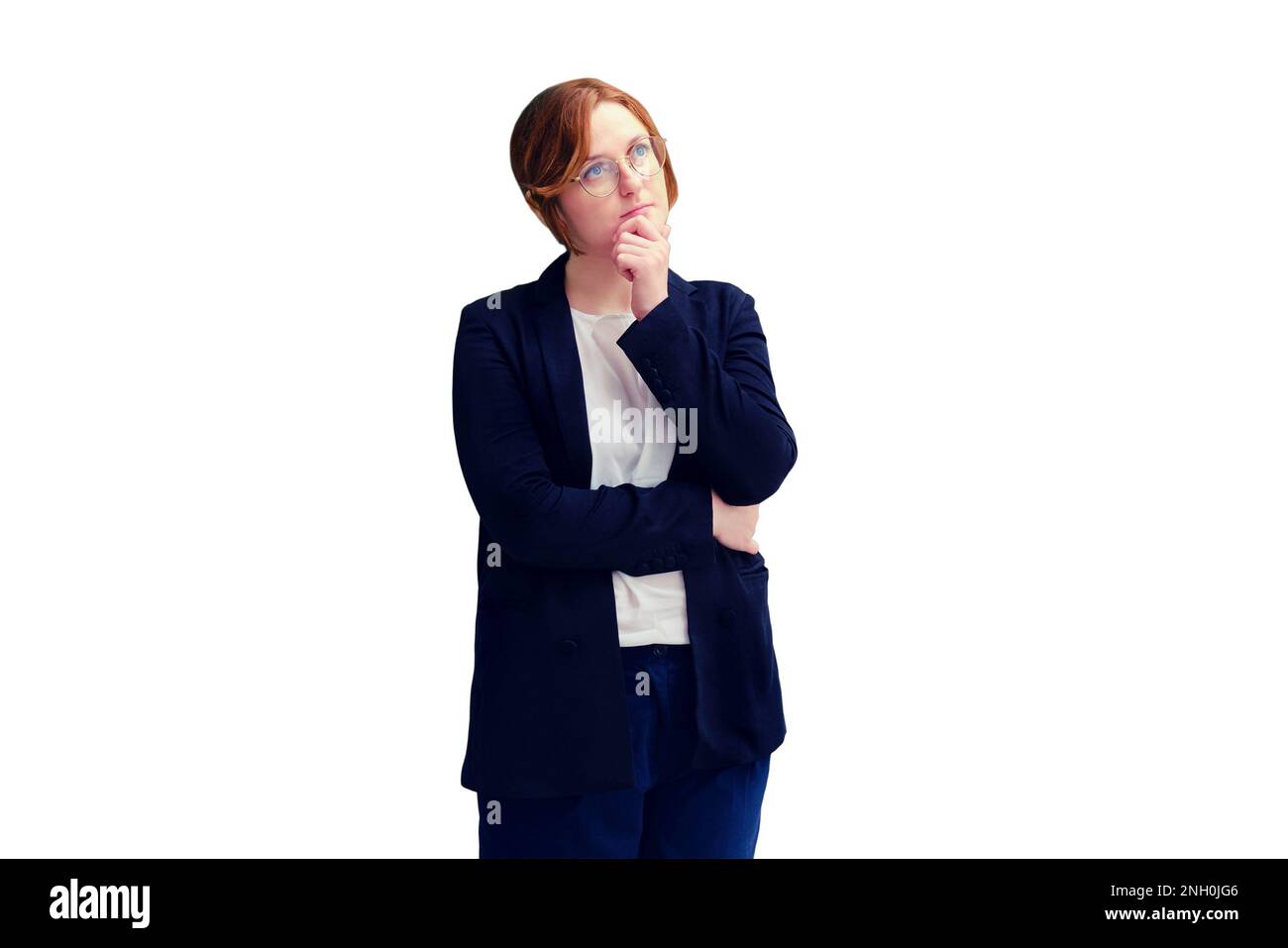 A school teacher stands doubtfully in front of an empty blackboard ...
