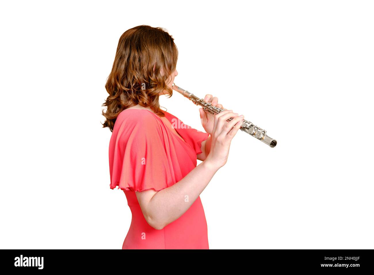 Woman musician with a flute on a studio isolated white background ...
