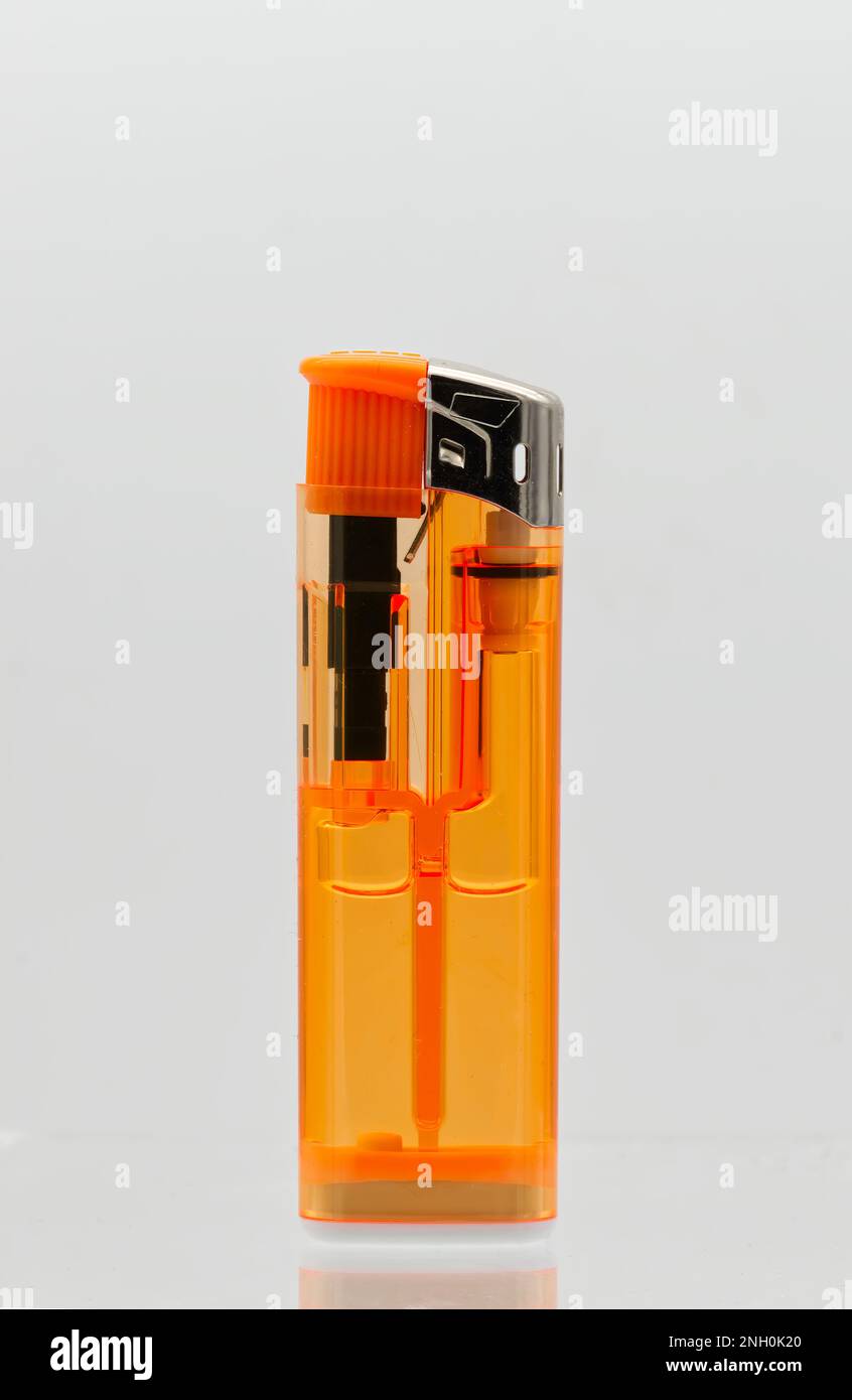 Orange transparent lighter isolated on white background Stock Photo - Alamy