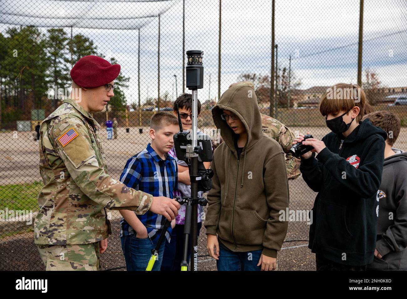 U.S. Paratroopers assigned to the 82nd Airborne Division show students ...