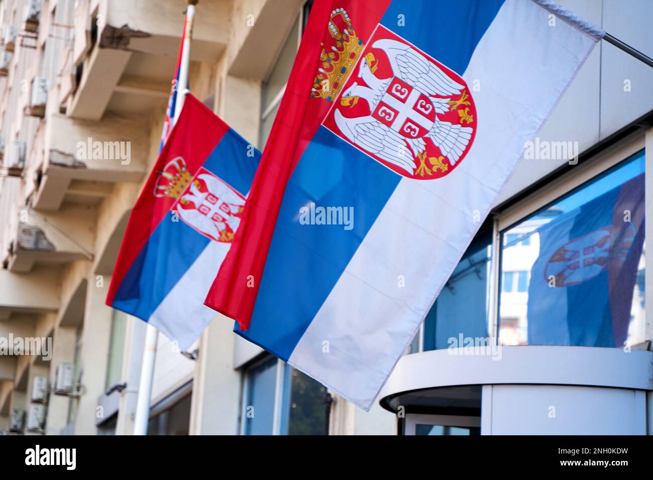 Close-up of Serbian flags on the facade of the building near the ...