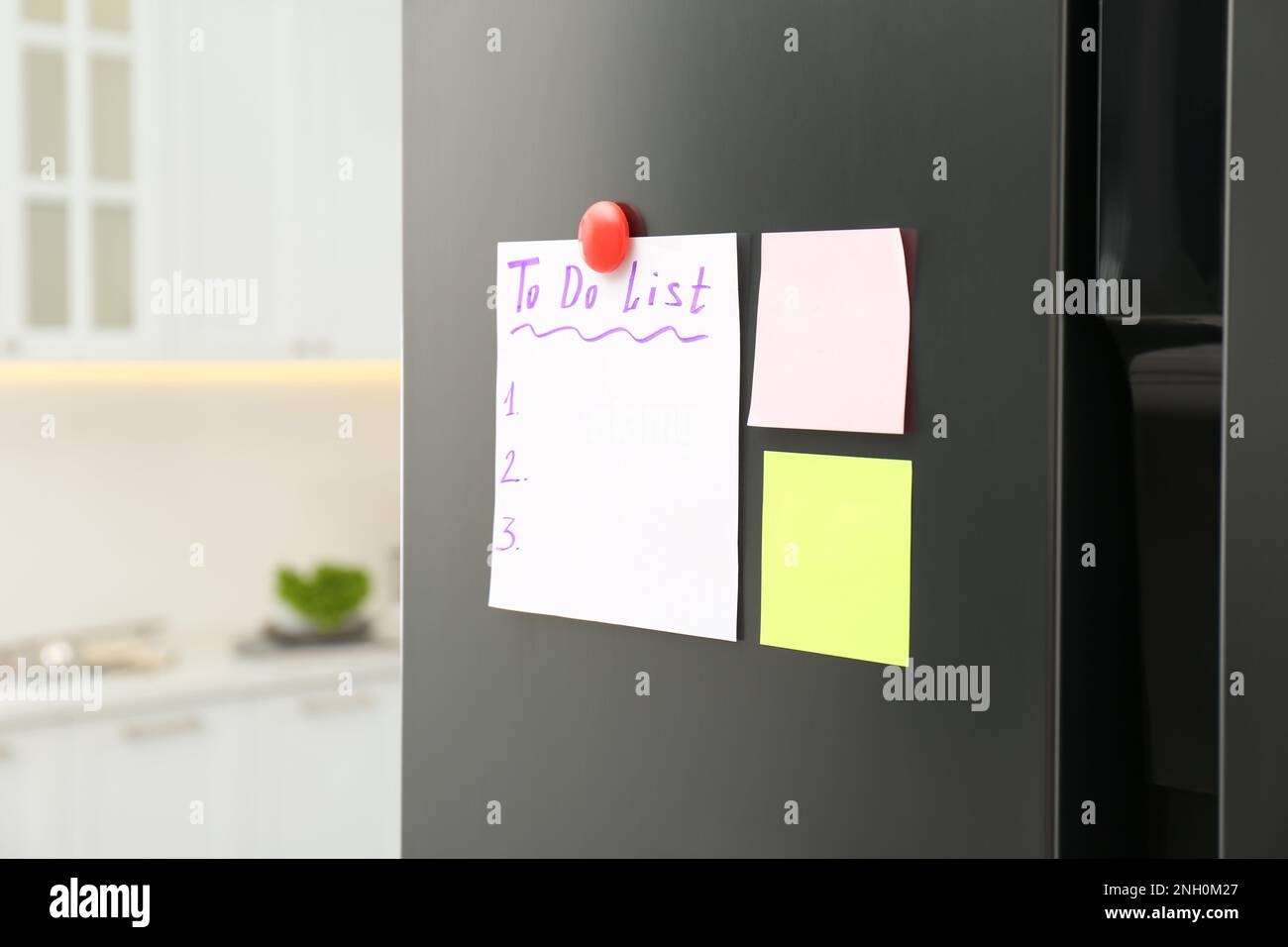 Blank To do list and sticky notes on fridge in kitchen. Space for text ...