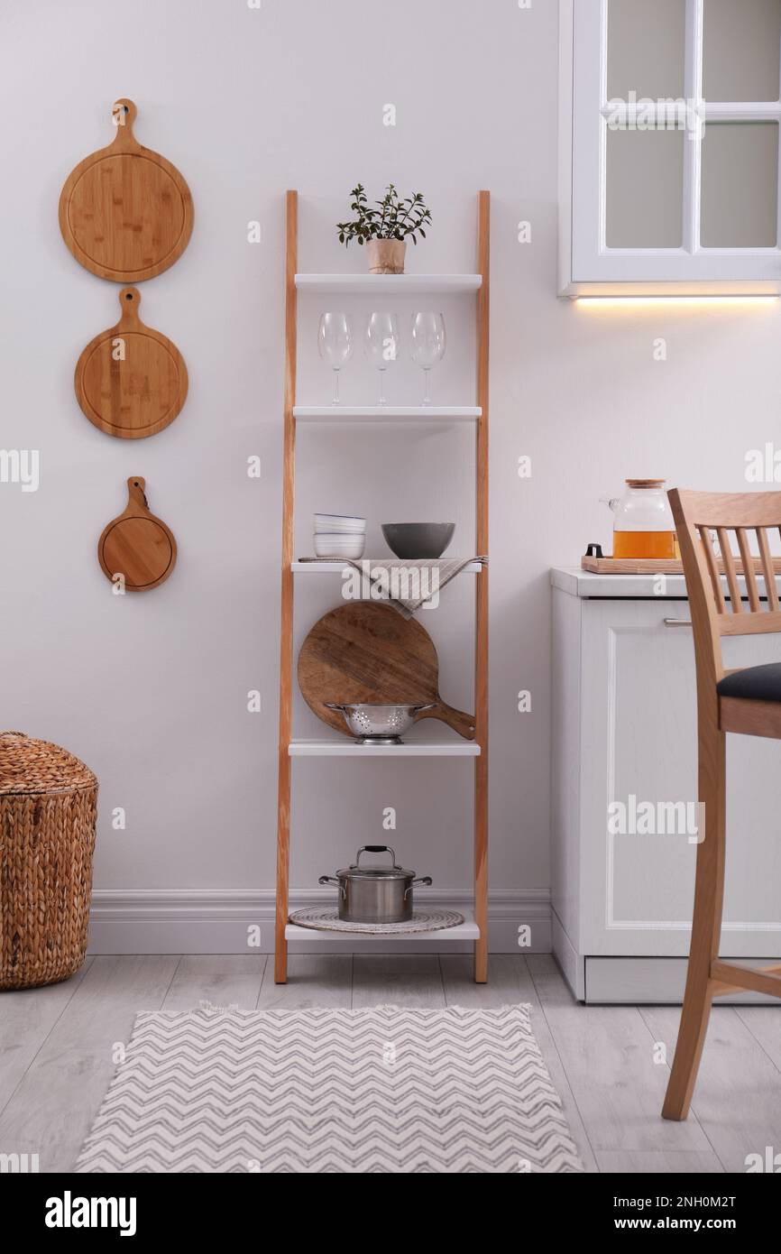 Stylish kitchen room interior with wooden ladder near white wall Stock ...