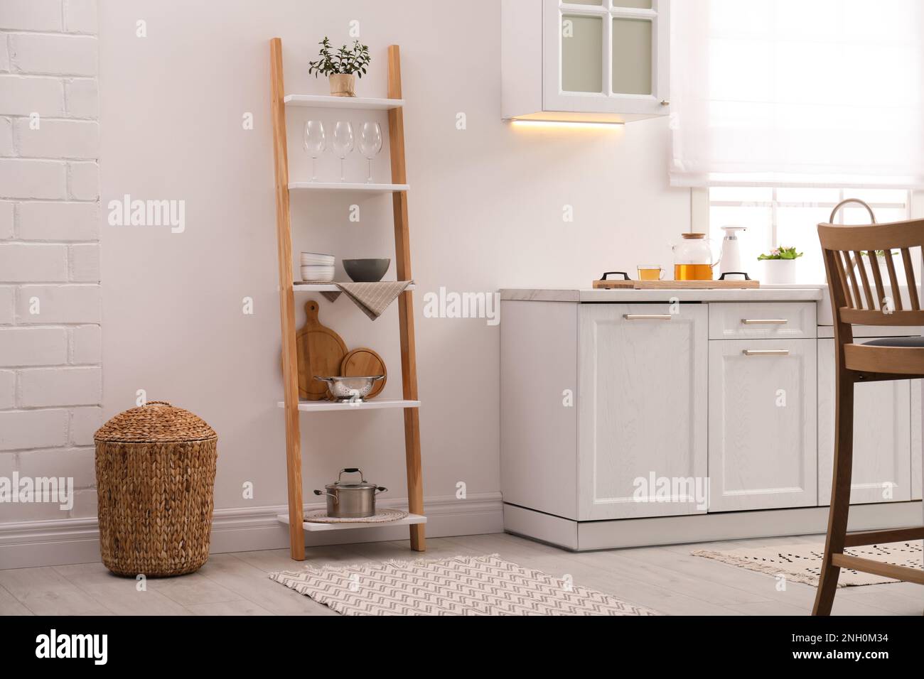 Stylish kitchen room interior with wooden ladder near white wall Stock ...