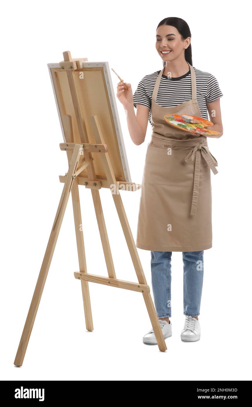 Young woman drawing on easel against white background Stock Photo - Alamy