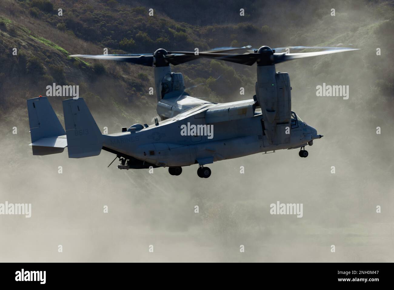 A U.S. Marine MV-22 Osprey tiltrotor aircraft with Marine Medium ...
