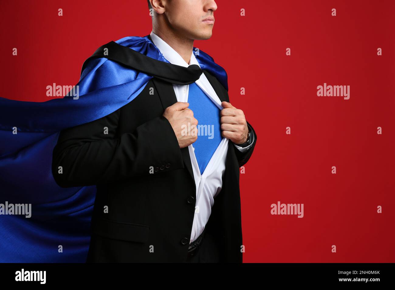 Superhero man taking suit off hi-res stock photography and images - Alamy